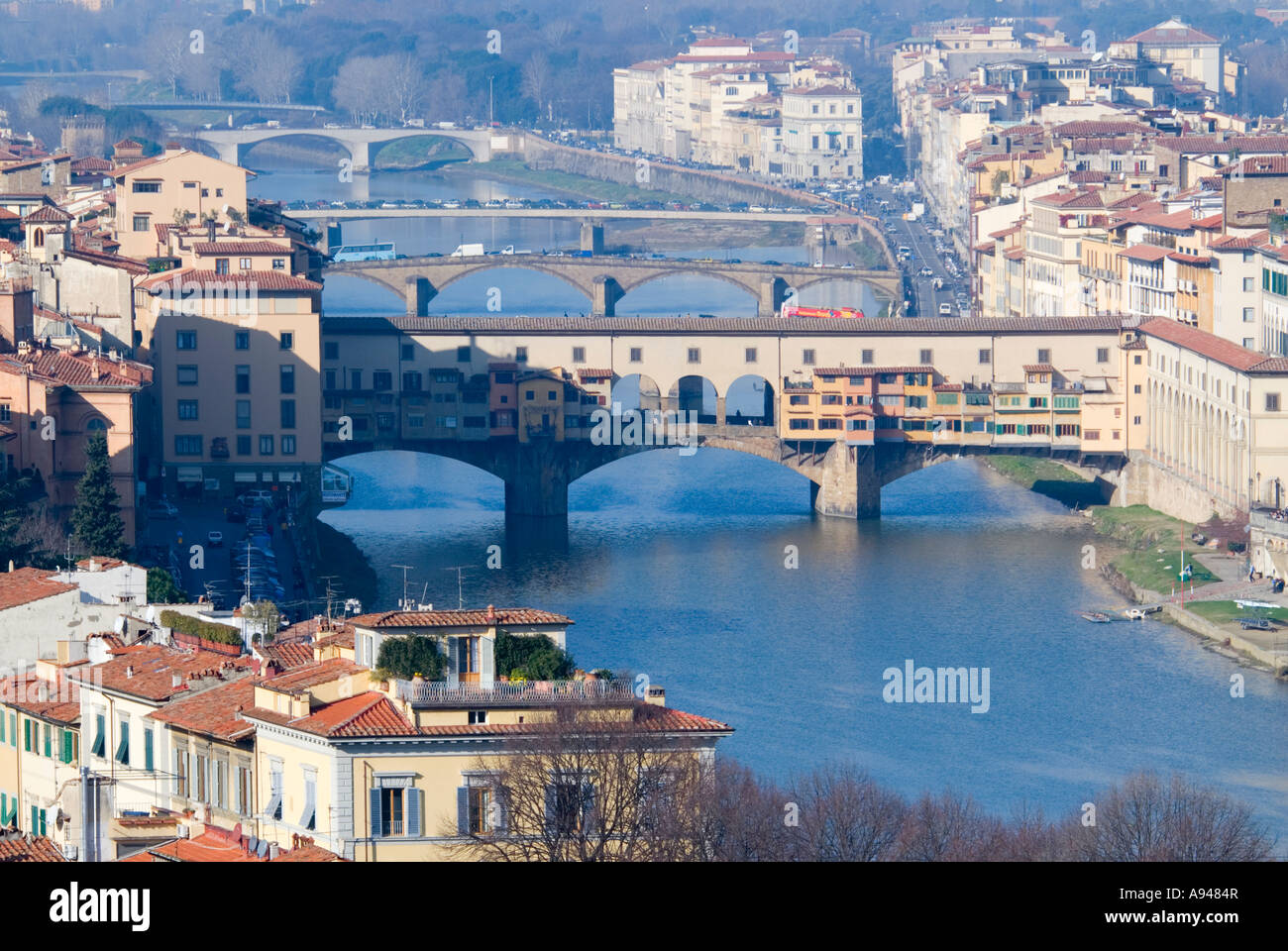 Horizontal aerial view across the roofs of Florence to the Ponte ...