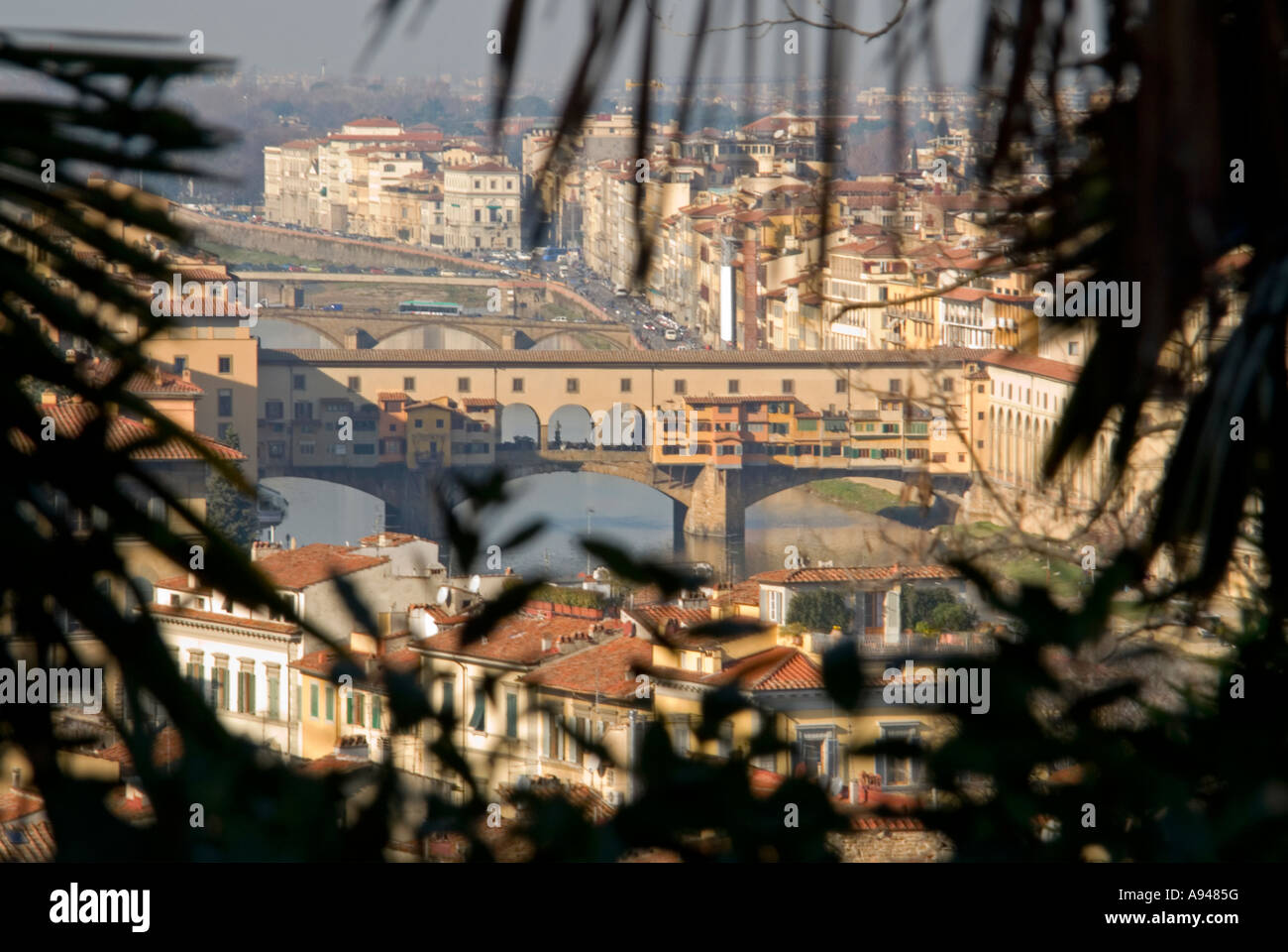 Horizontal aerial view across the roofs of Florence to the Ponte ...