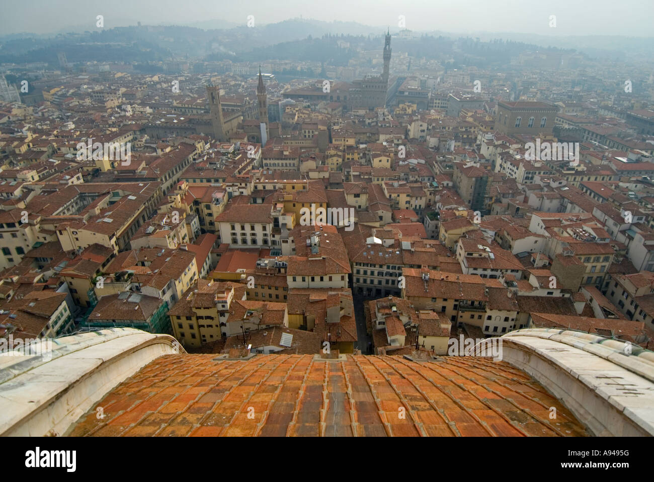 Horizontal aerial view across the orange roofs of Florence from the top ...