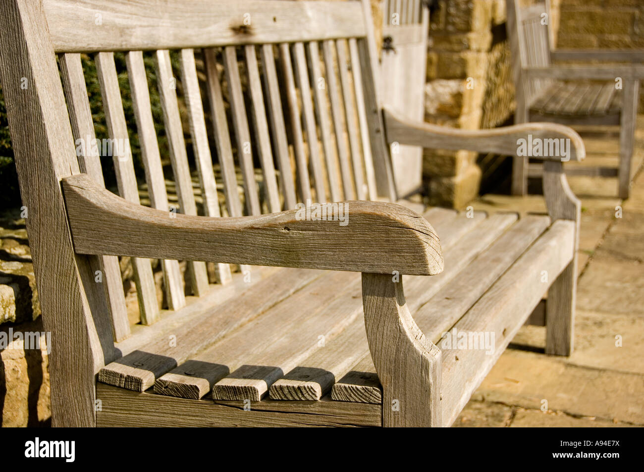 Close up of Wooden garden seat benches and gate England UK United ...