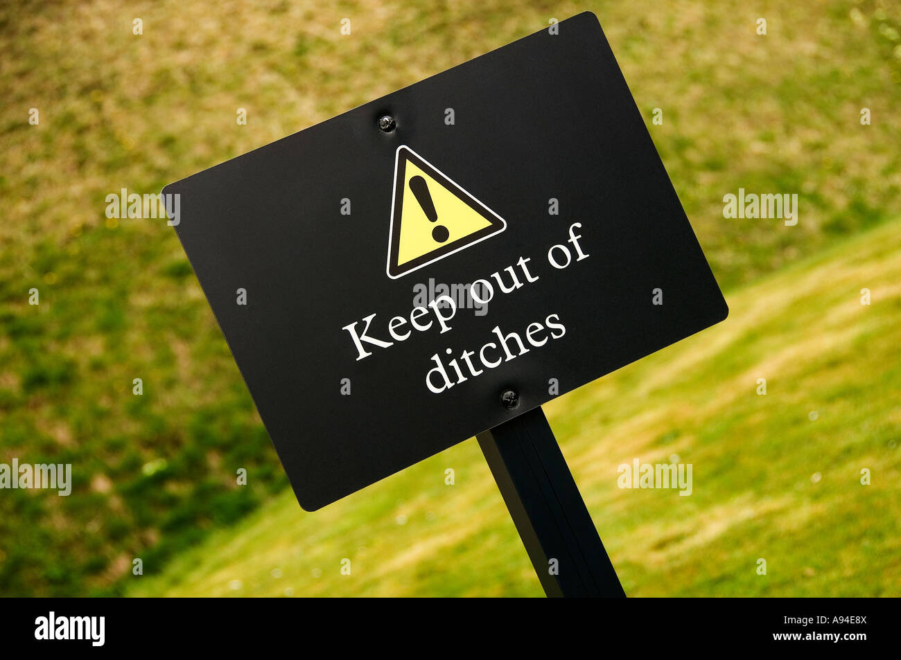 Close up of Keep out of ditches warning sign Stock Photo - Alamy