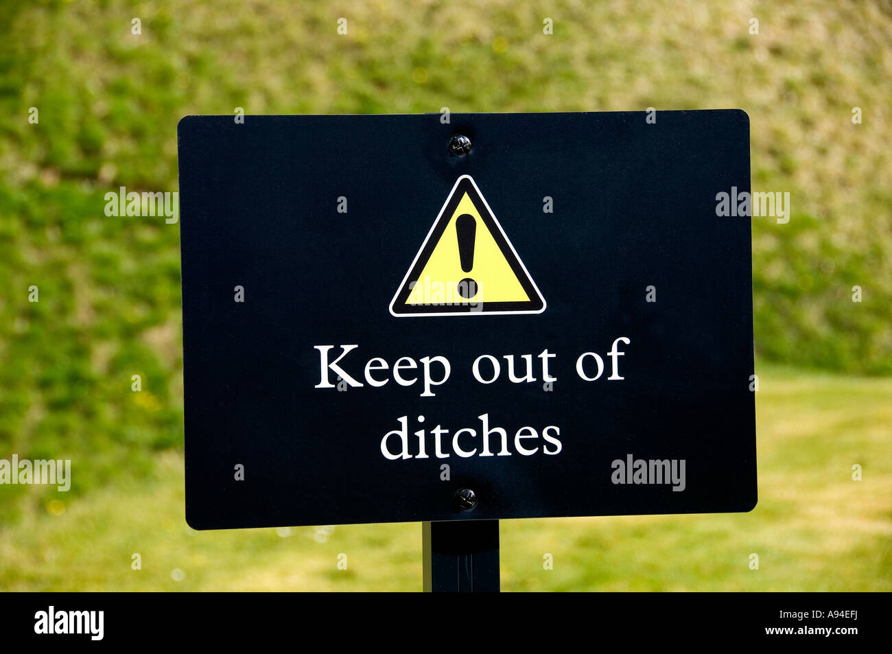Close up of Keep out of ditches warning sign England UK United Kingdom ...