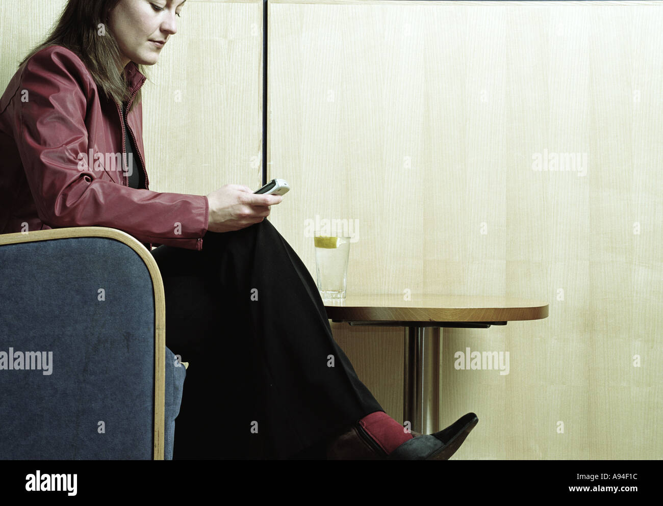 Girl seated texting hi-res stock photography and images - Alamy