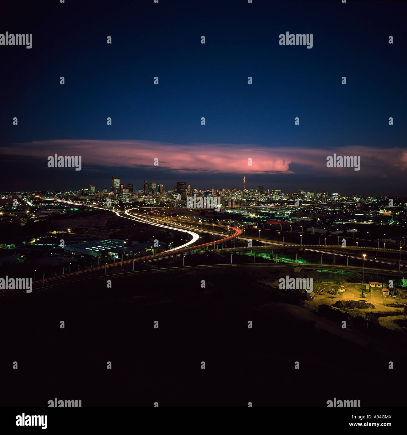 A view of Johannesburg city skyline at dusk showing the main highways ...