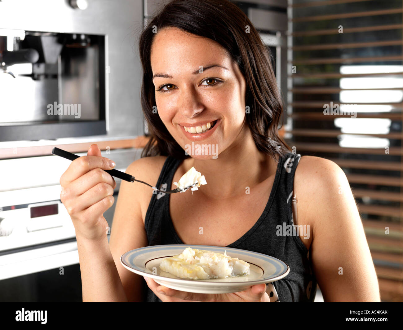 Woman Eating Fish Model Released Stock Photo - Alamy