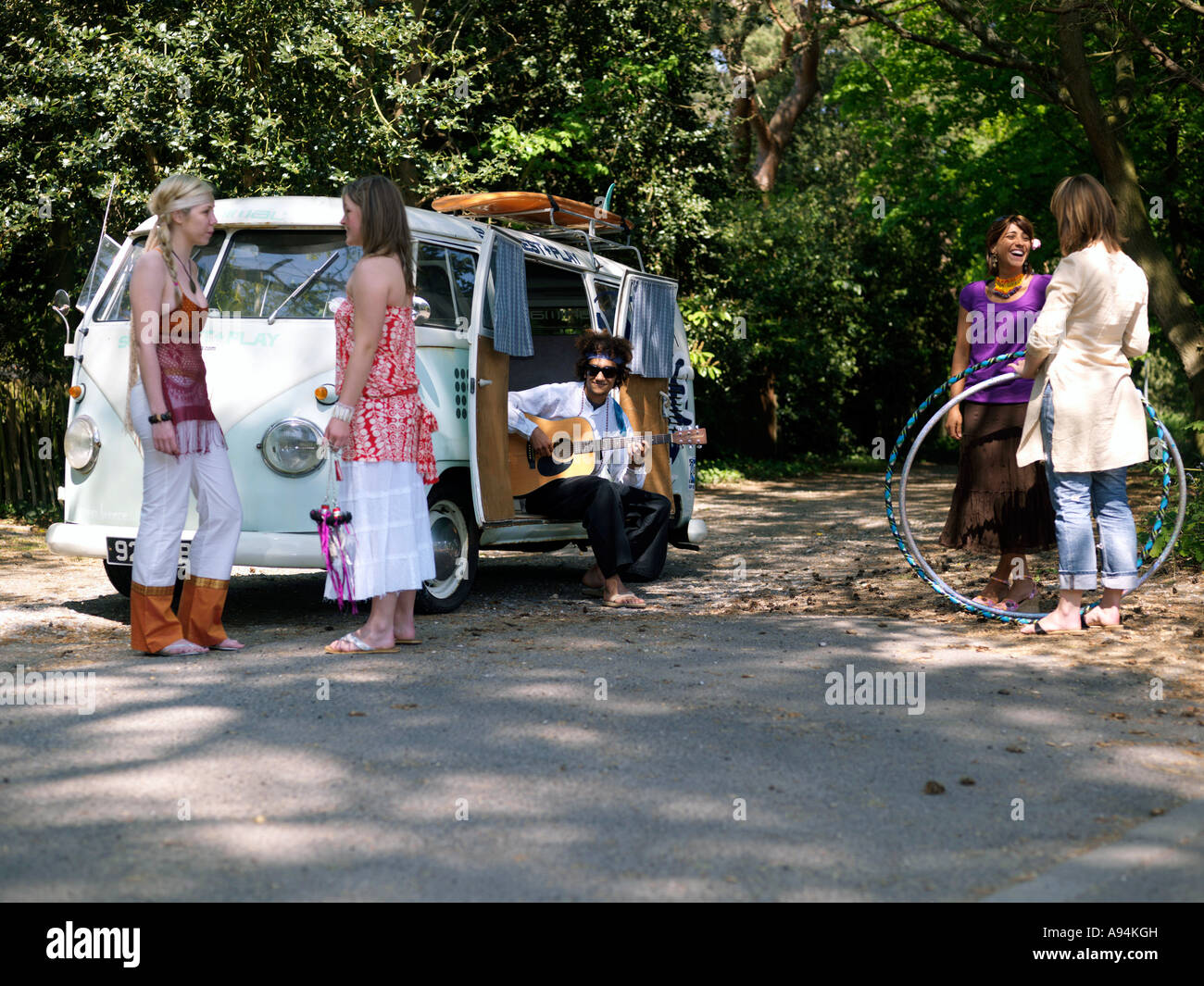 Young People In A Small Hippy Community With A Camper Van Enjoying A ...