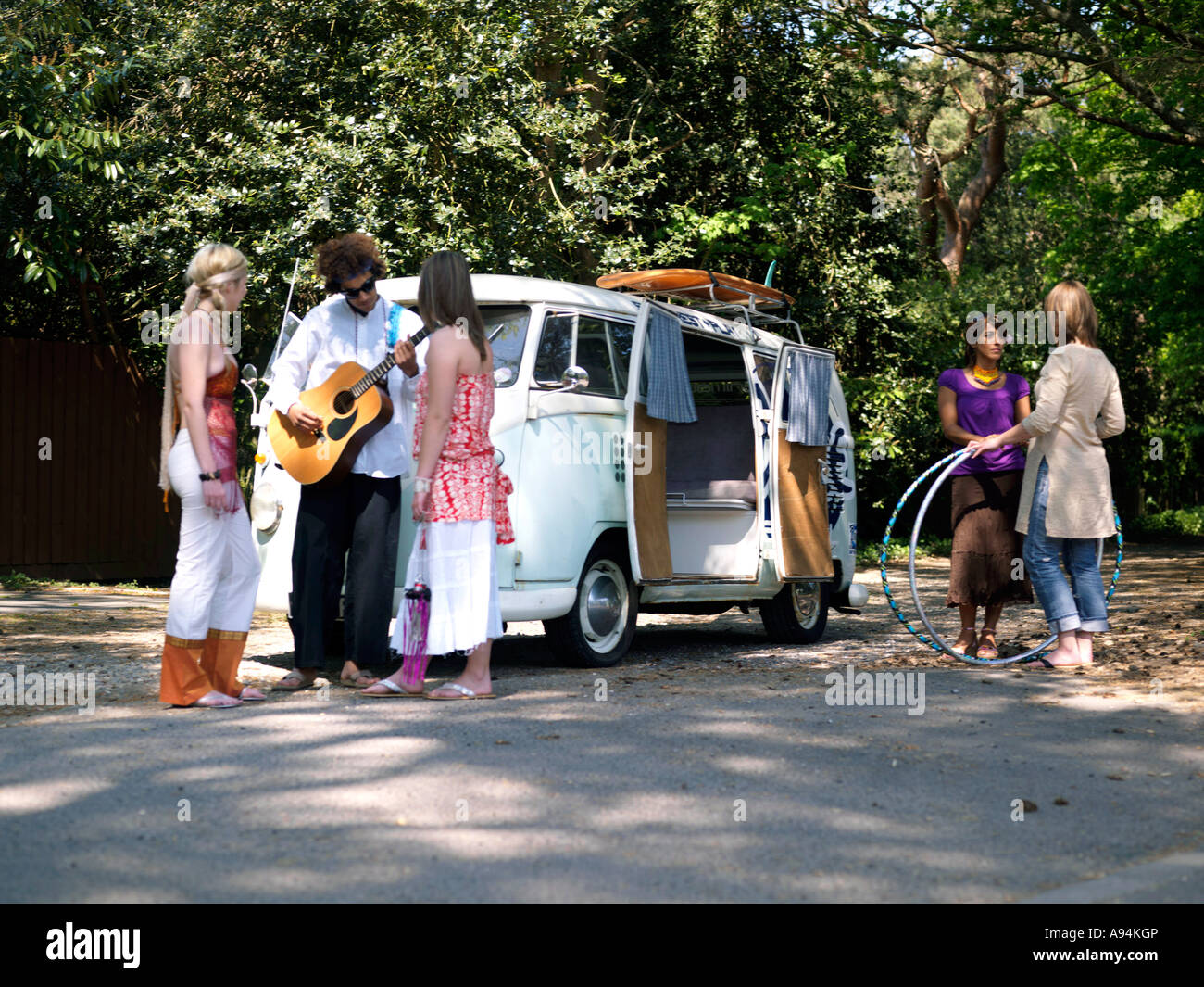 Young People In A Small Hippy Community With A Camper Van Enjoying A ...