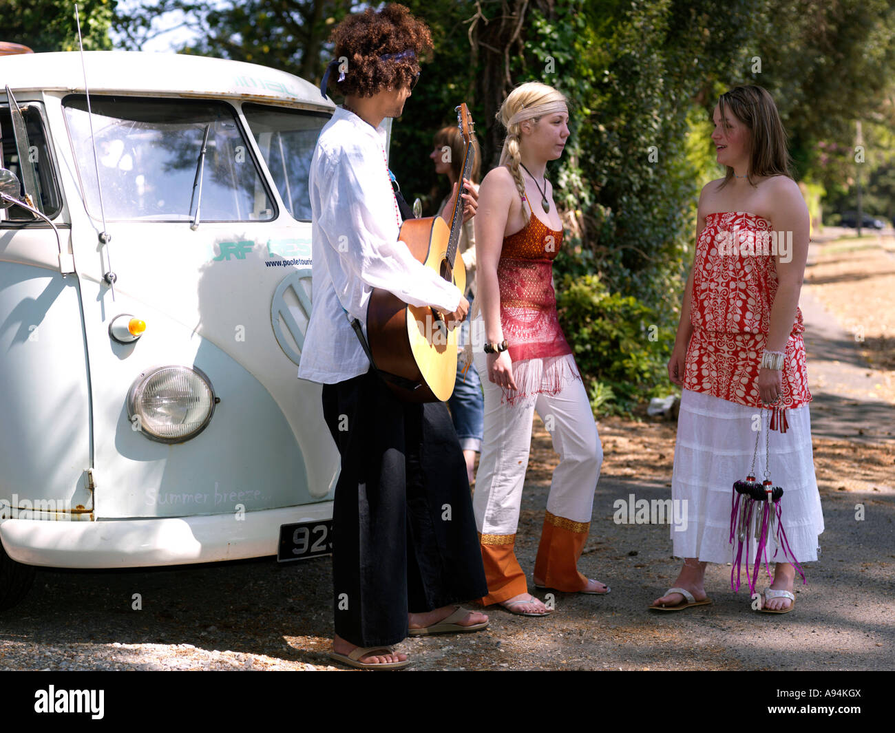 Young People In A Small Hippy Community With A Camper Van Enjoying A ...