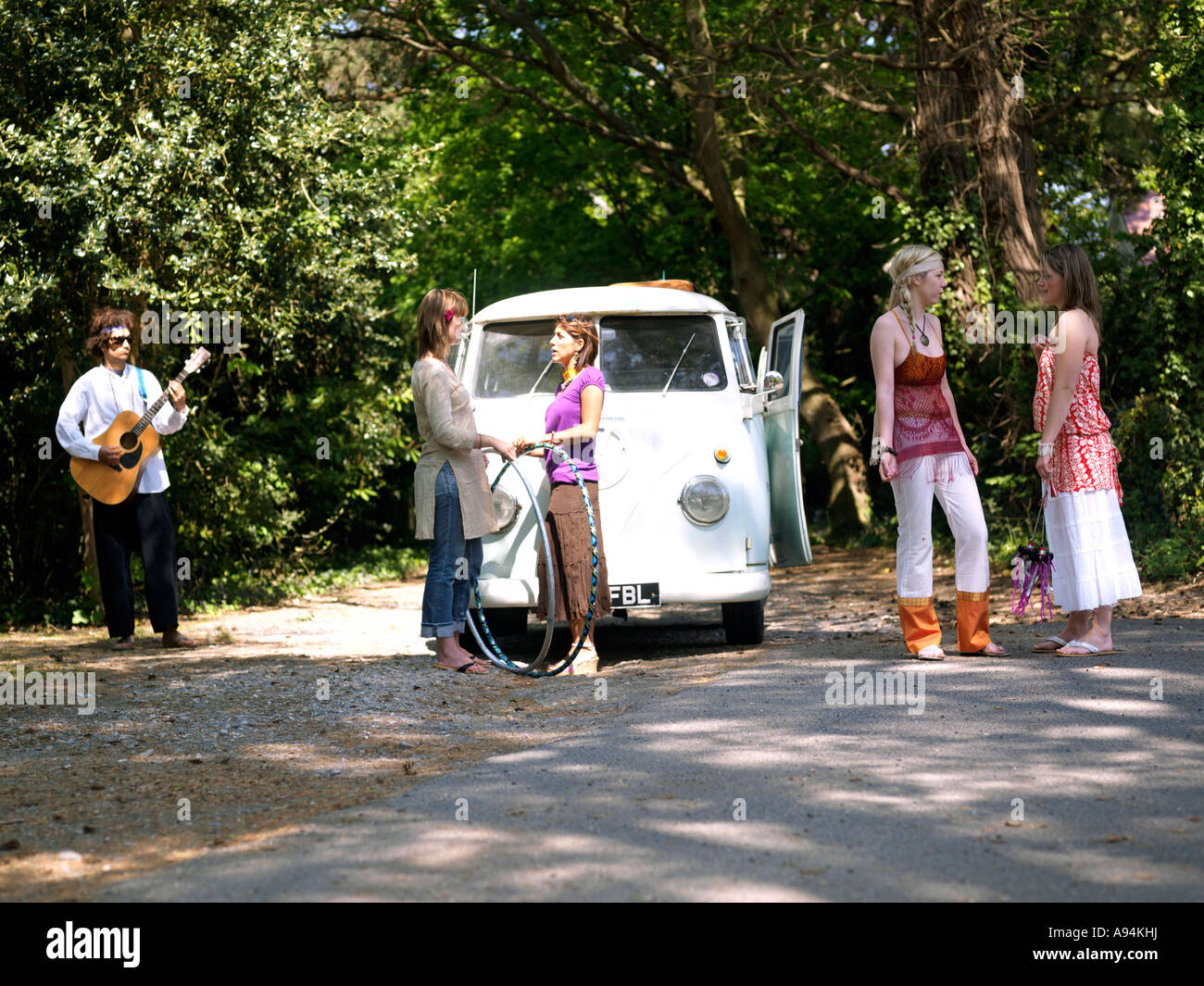 Young People In A Small Hippy Community With A Camper Van Enjoying A ...