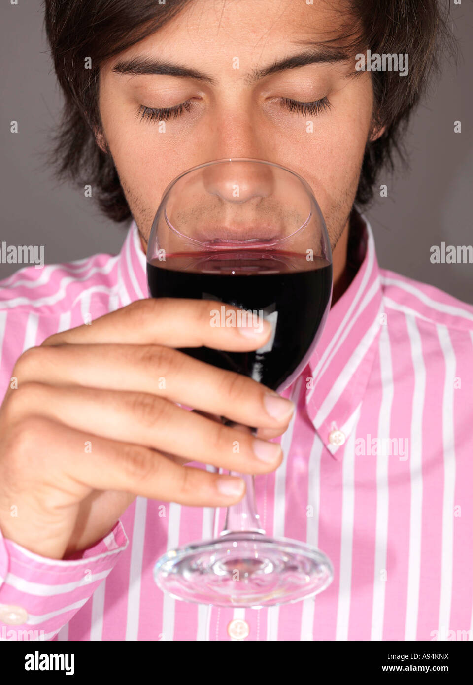 Young Man Drinking Wine Model Released Stock Photo - Alamy