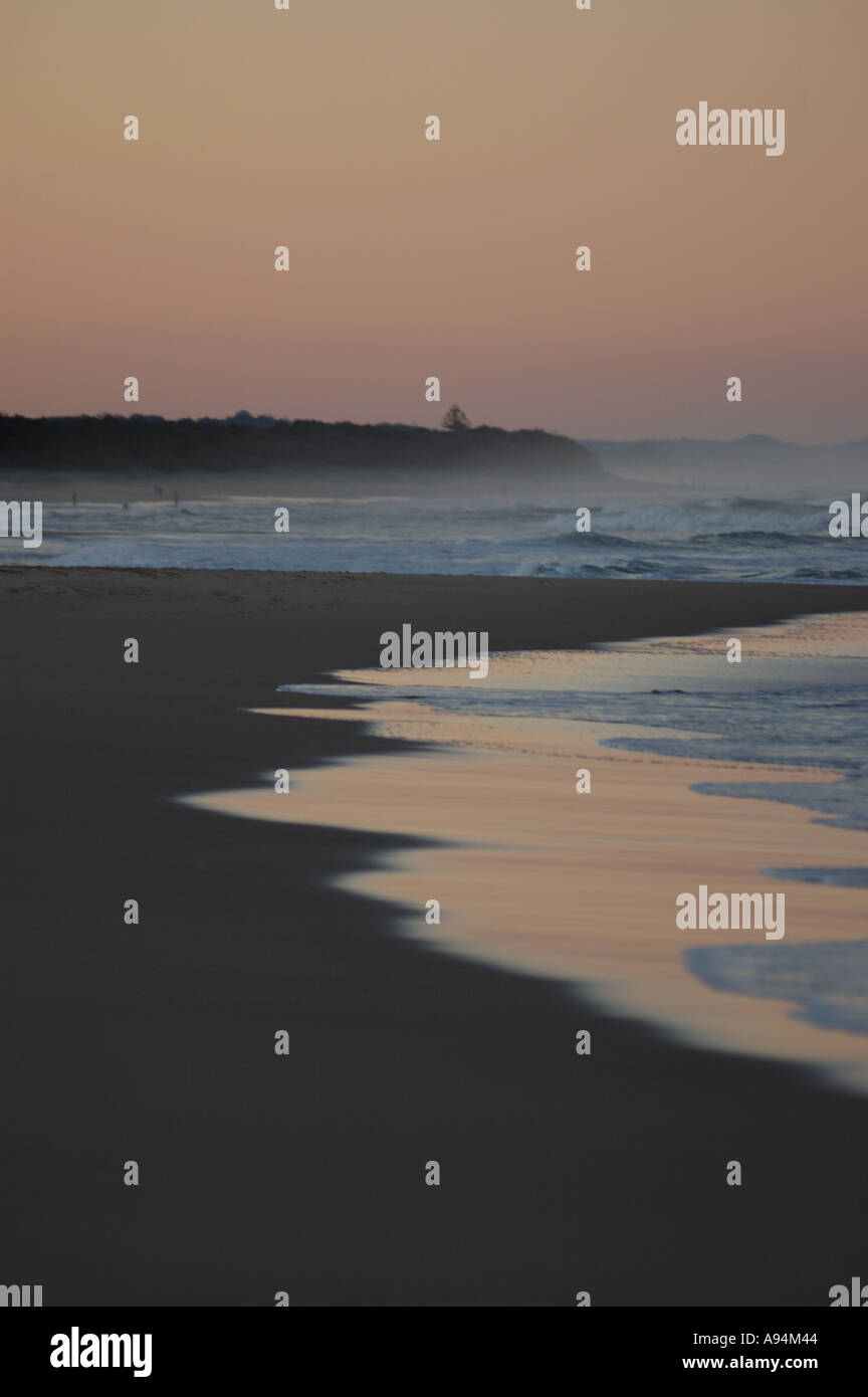 shine sheen of receding wave on beach Stock Photo - Alamy