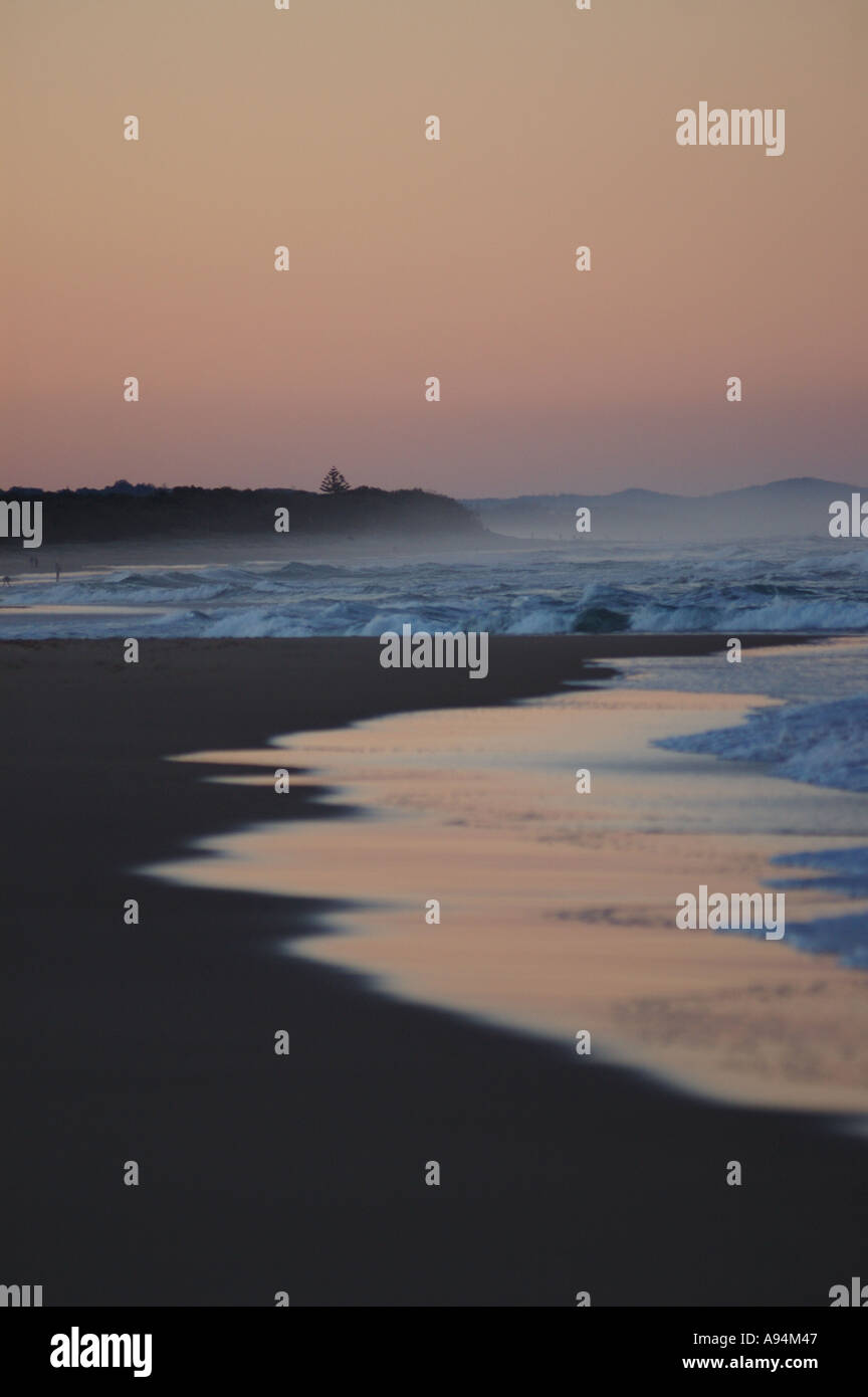 shine sheen of receding wave on beach Stock Photo - Alamy