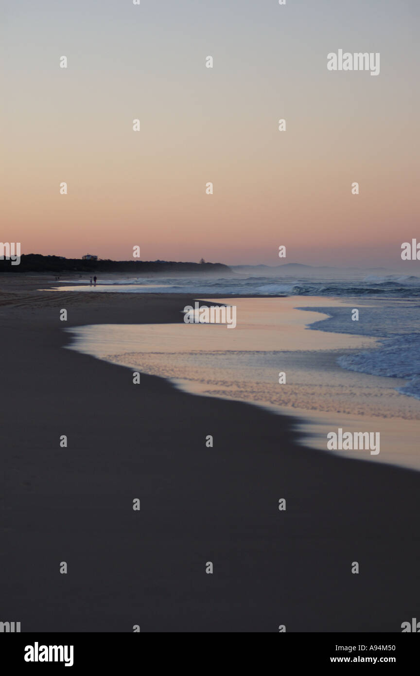 shine sheen of receding wave on beach Stock Photo - Alamy