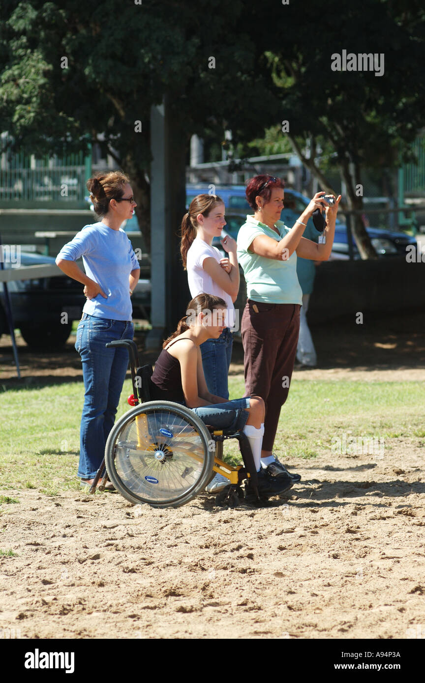 family group watching disabled games Stock Photo - Alamy