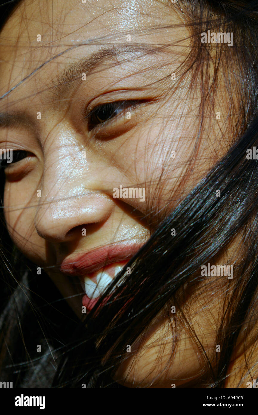 Portrait hair across face woman hi-res stock photography and images - Alamy