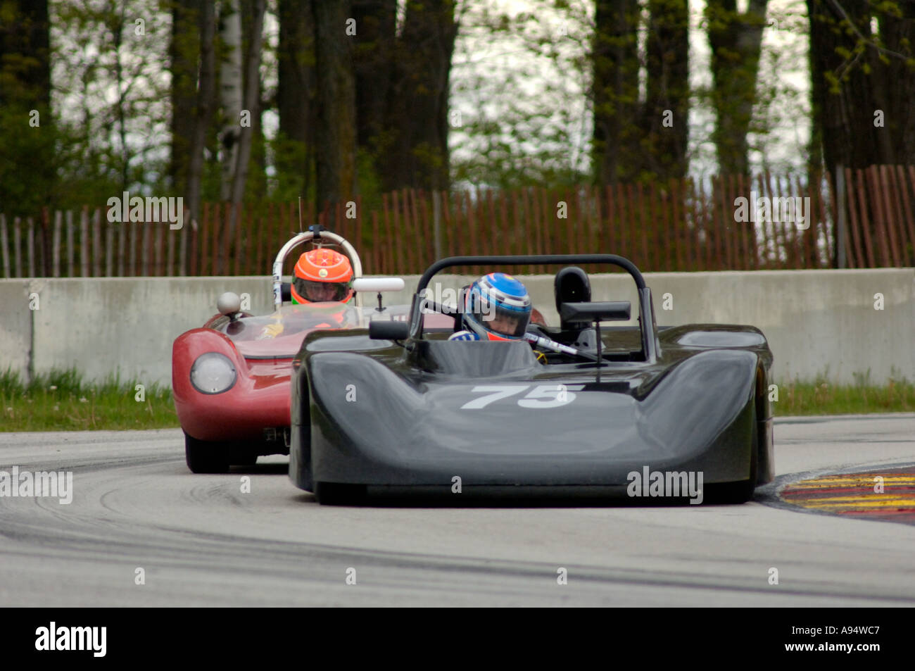 Deane Tank in his 1986 Lola T86 90 followed by Travis Engen in his 1962 ...