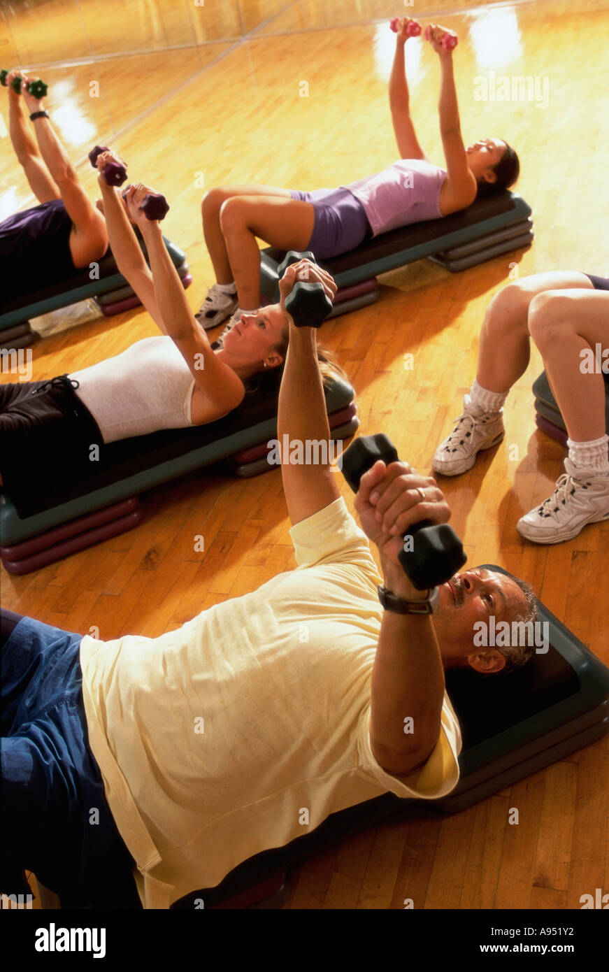 Mature woman exercising step class hi-res stock photography and images ...