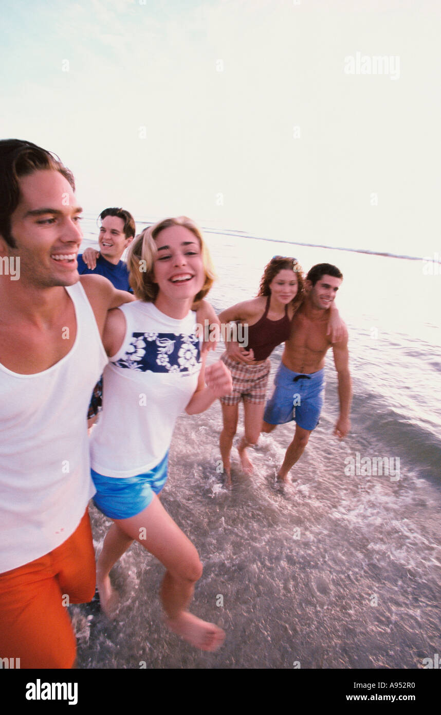 Three young couples on the beach Stock Photo - Alamy