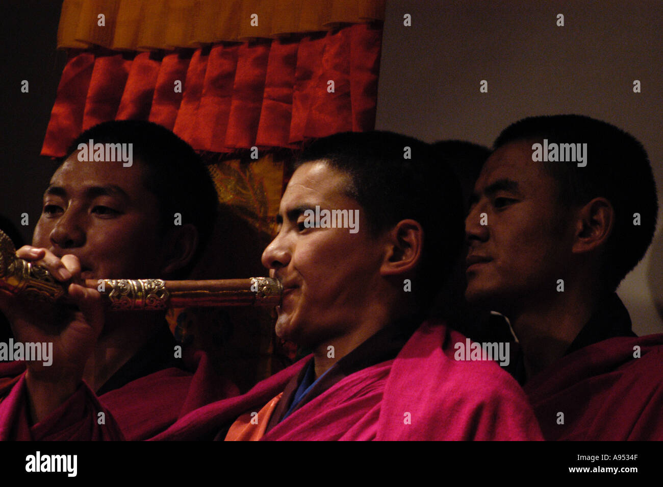 Tibetan monks performing sacred music Stock Photo - Alamy