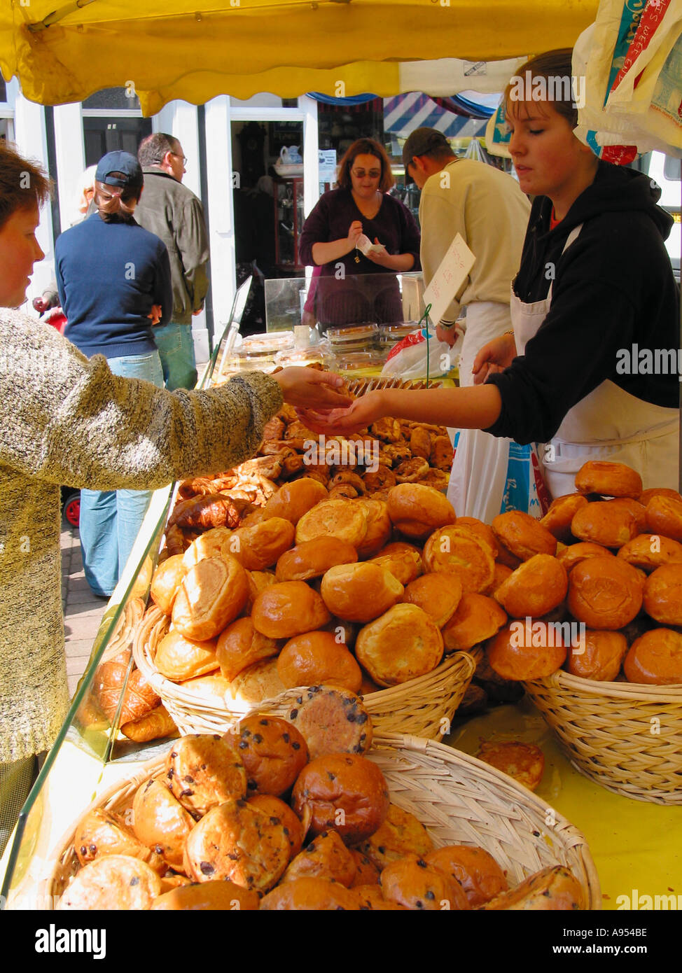 French Bakery, lady buying French bread, French boulangerie stall ...