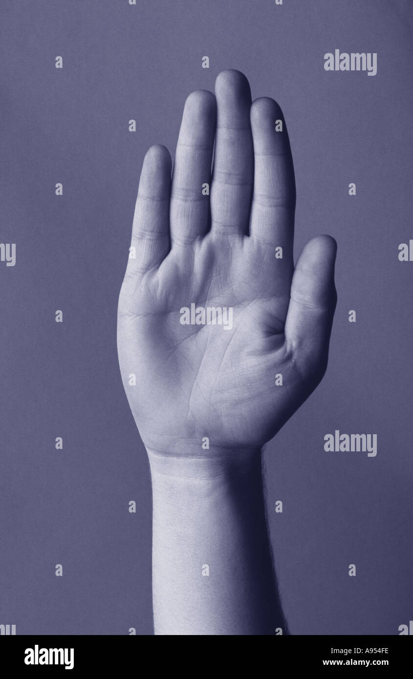 Hand making halt sign Stock Photo - Alamy