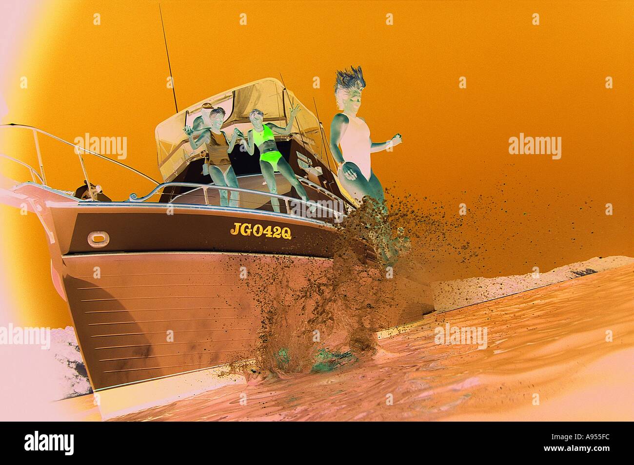 Photograph of people diving from boat Stock Photo - Alamy