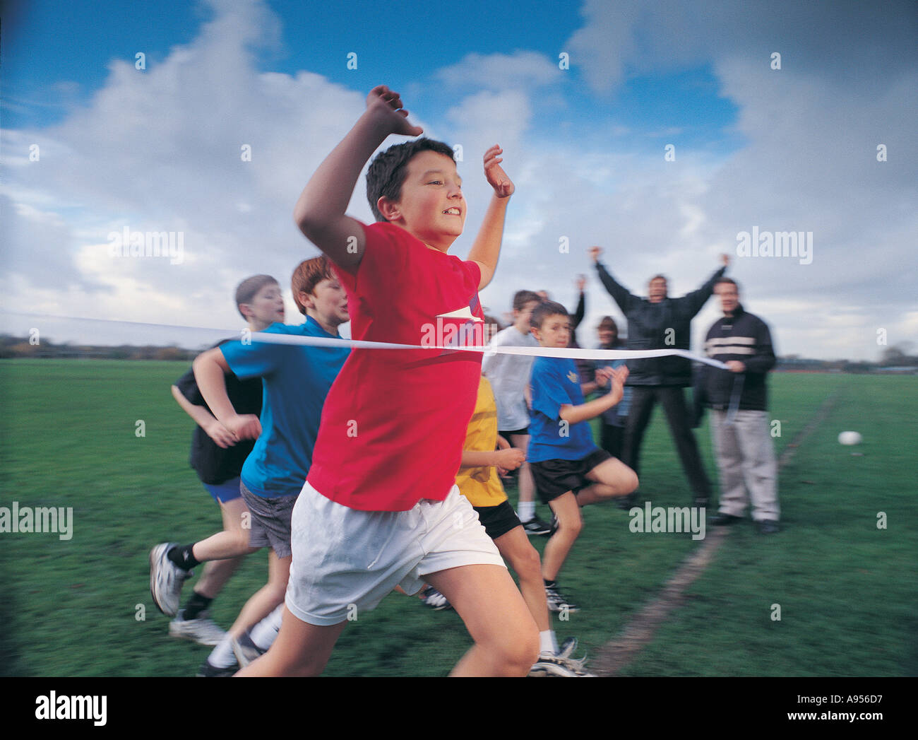 Photograph of child winning race Stock Photo - Alamy