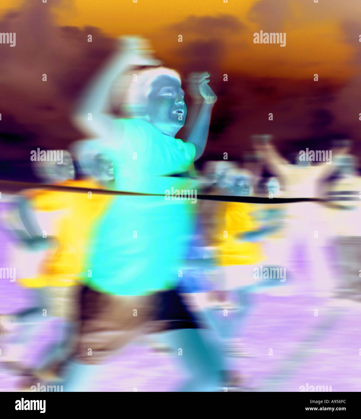 Photograph of boy winning race Stock Photo - Alamy