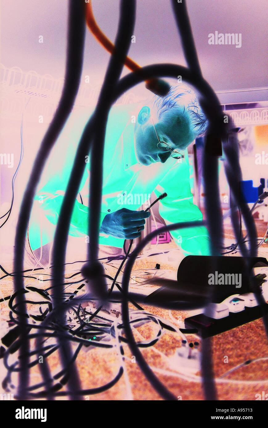 Photograph of engineer with cabling Stock Photo - Alamy