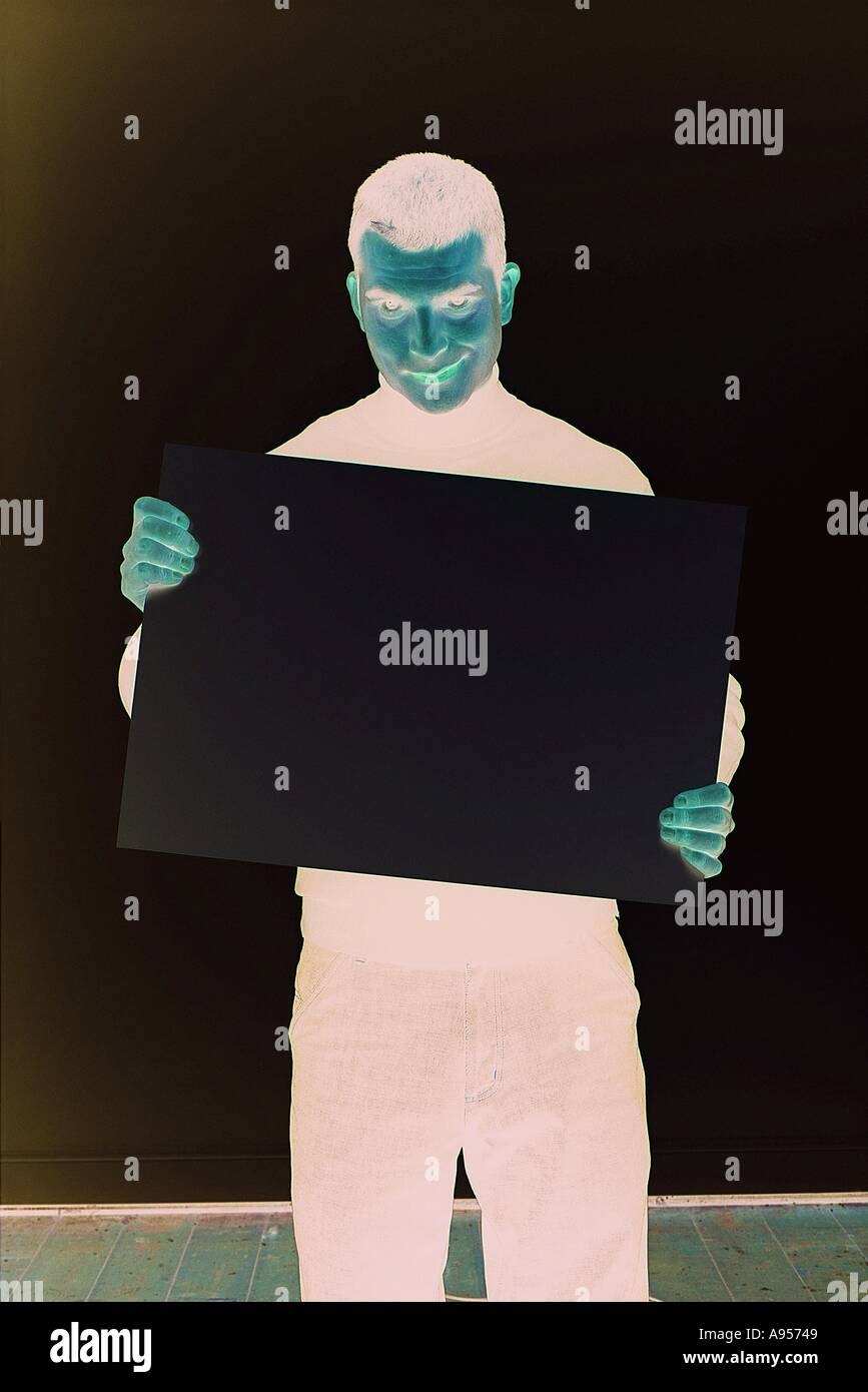 Photograph of man holding sign Stock Photo - Alamy