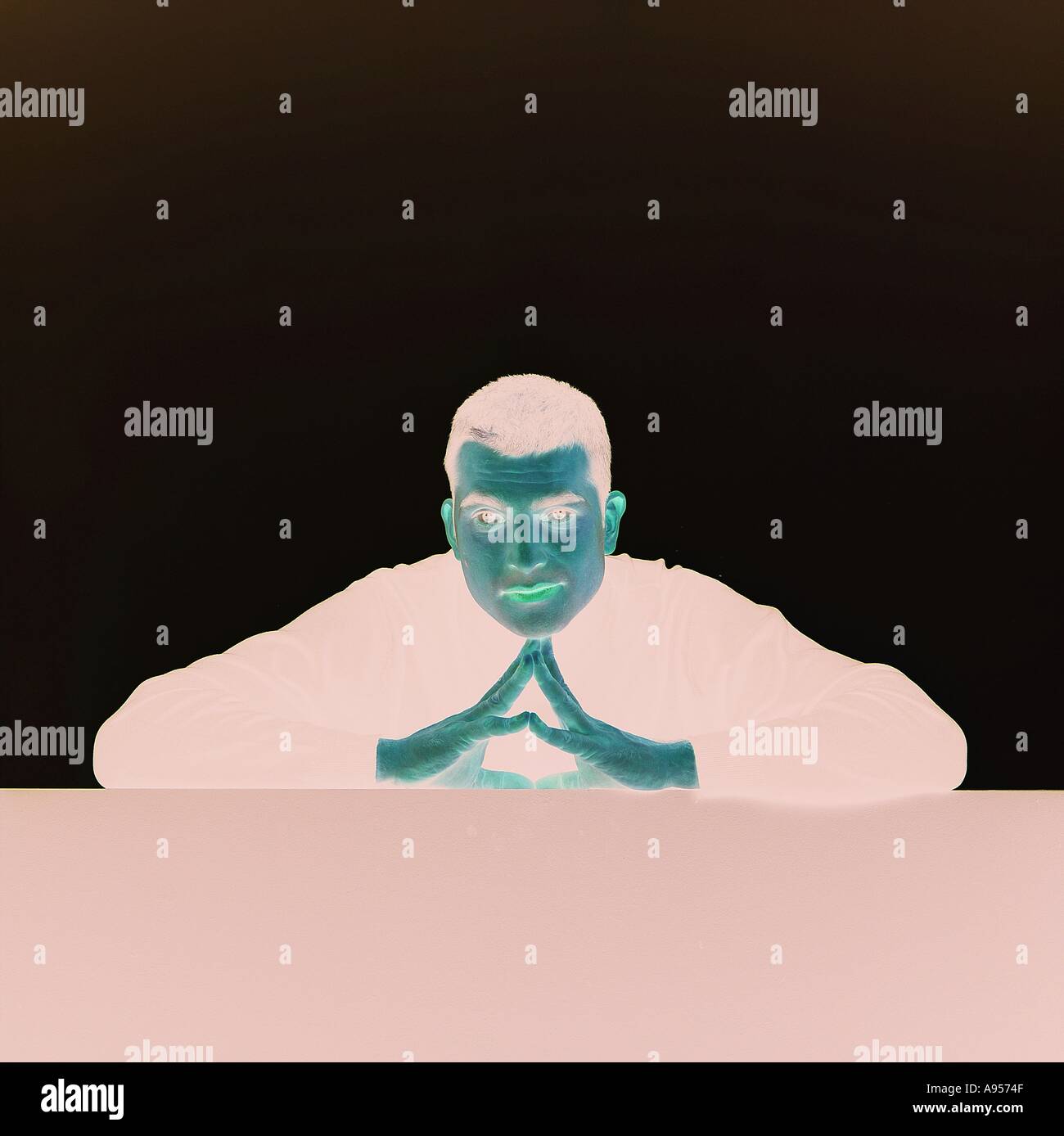 Photograph of man looking over wall Stock Photo - Alamy