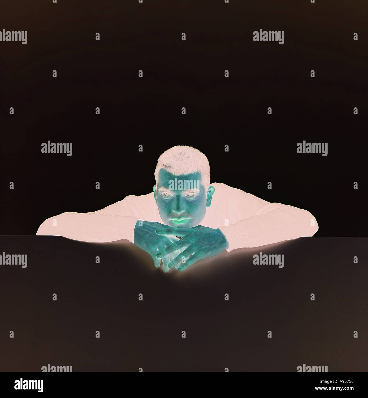 Photograph of man looking over wall Stock Photo - Alamy