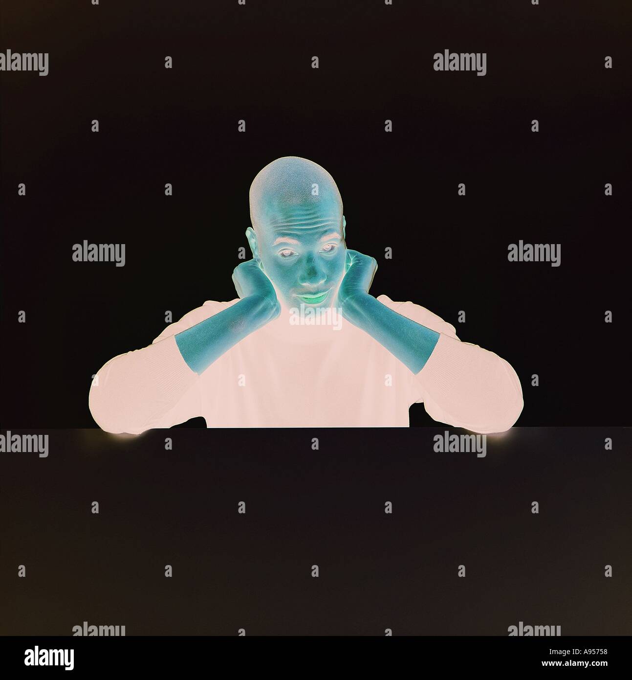 Photograph of man looking over wall Stock Photo - Alamy