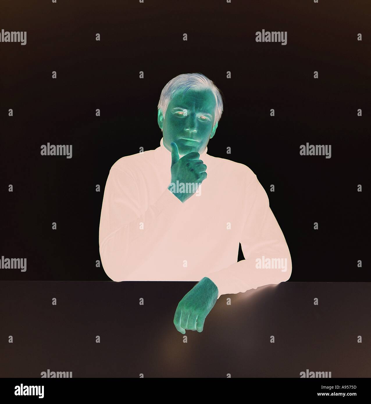 Photograph of man looking over wall Stock Photo - Alamy