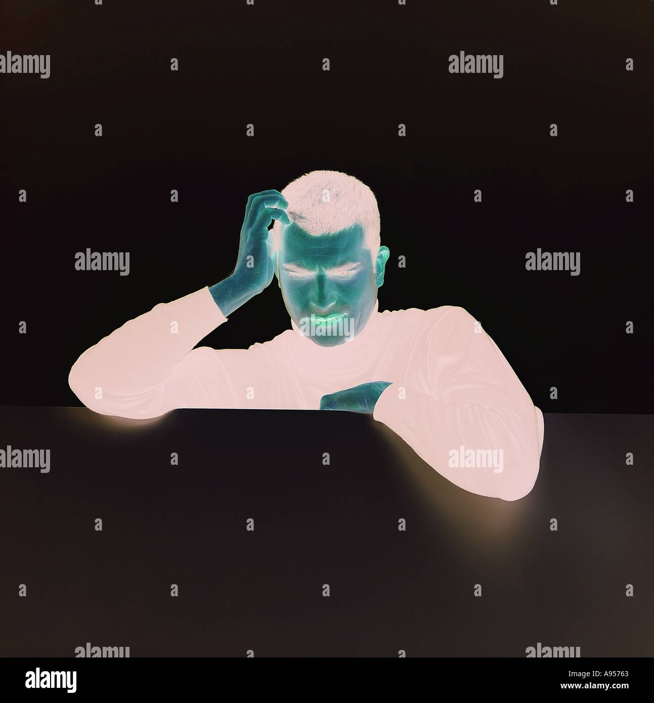 Photograph of man resting on top of wall Stock Photo - Alamy