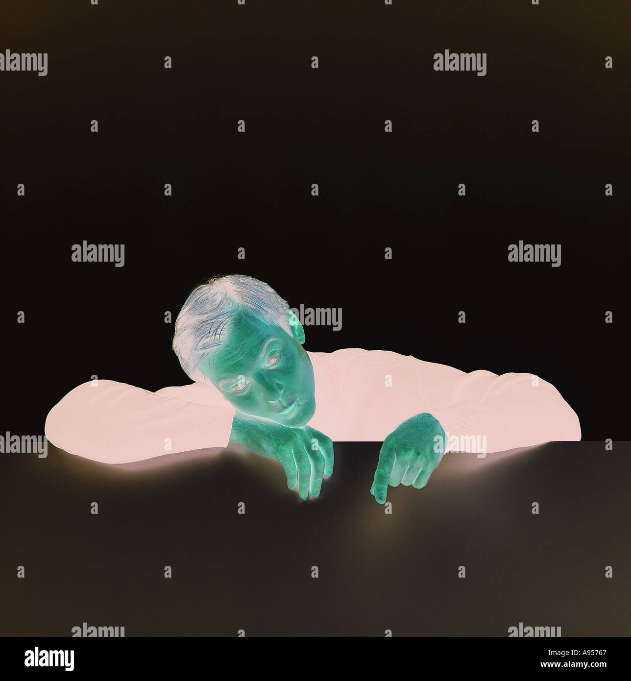 Photograph of man resting on top of wall Stock Photo - Alamy
