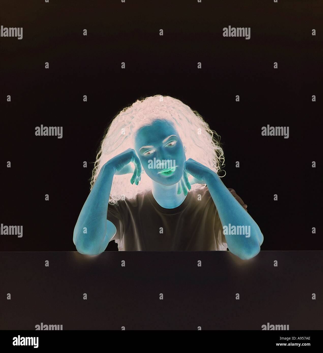 Photograph of woman looking over wall Stock Photo - Alamy