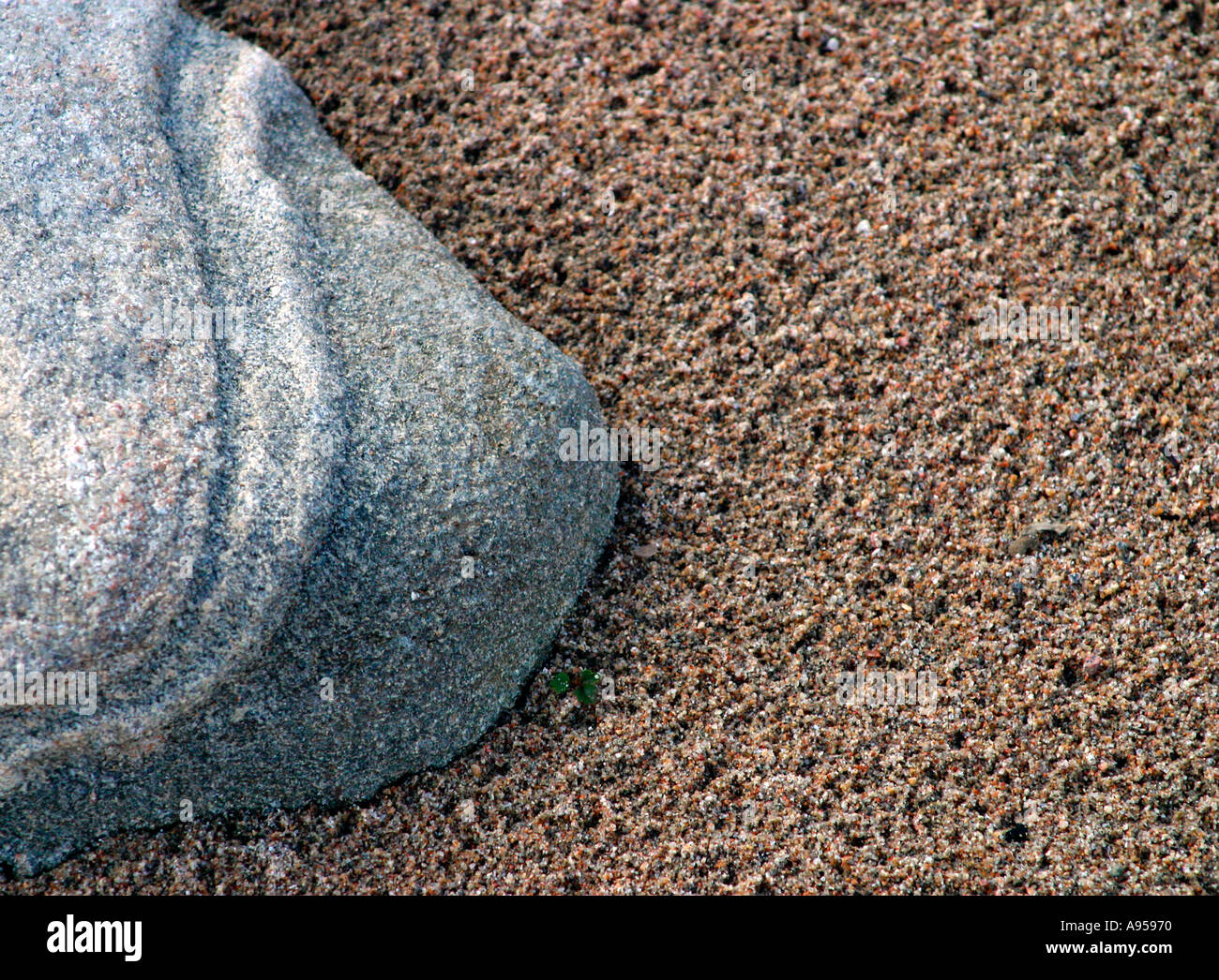 Rock in the sand in scenic Northern Canada Stock Photo - Alamy