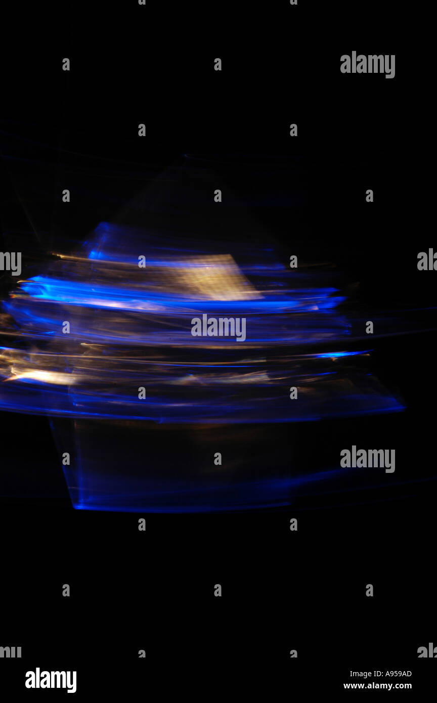 Illuminated blue star light swinging and blurred with movement. On ...