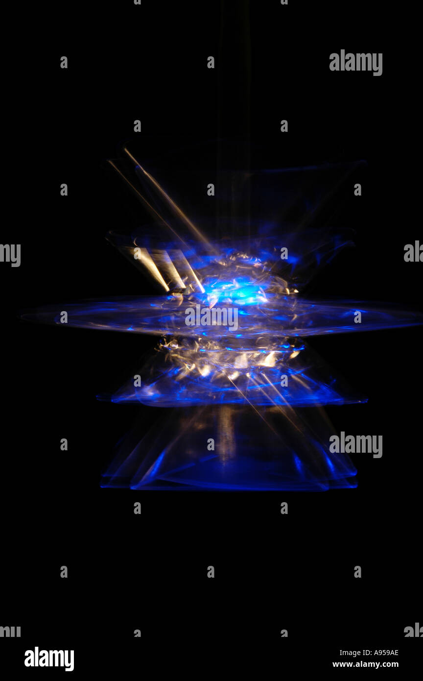 Illuminated blue star light swinging and blurred with movement. On ...