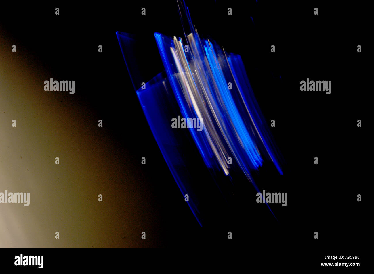 Illuminated blue star light swinging and blurred with movement. On ...