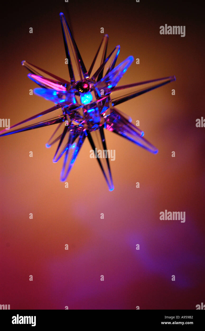 Illuminated blue star light, swinging and blurred with movement ...