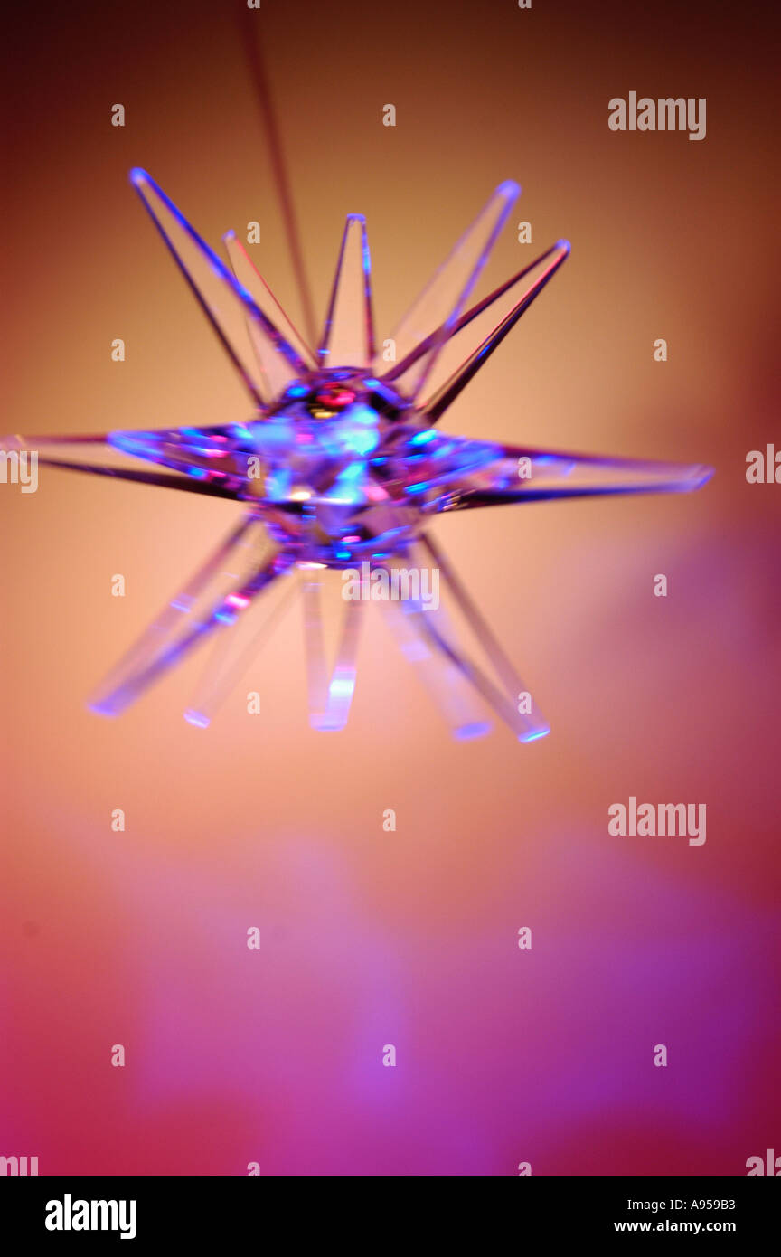 Illuminated blue star light, swinging and blurred with movement ...