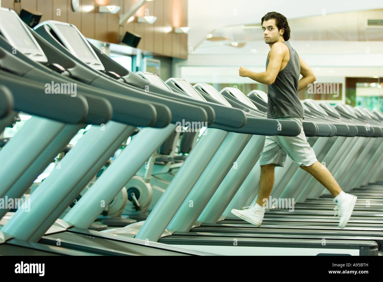 Man looking over shoulder running hi-res stock photography and images ...