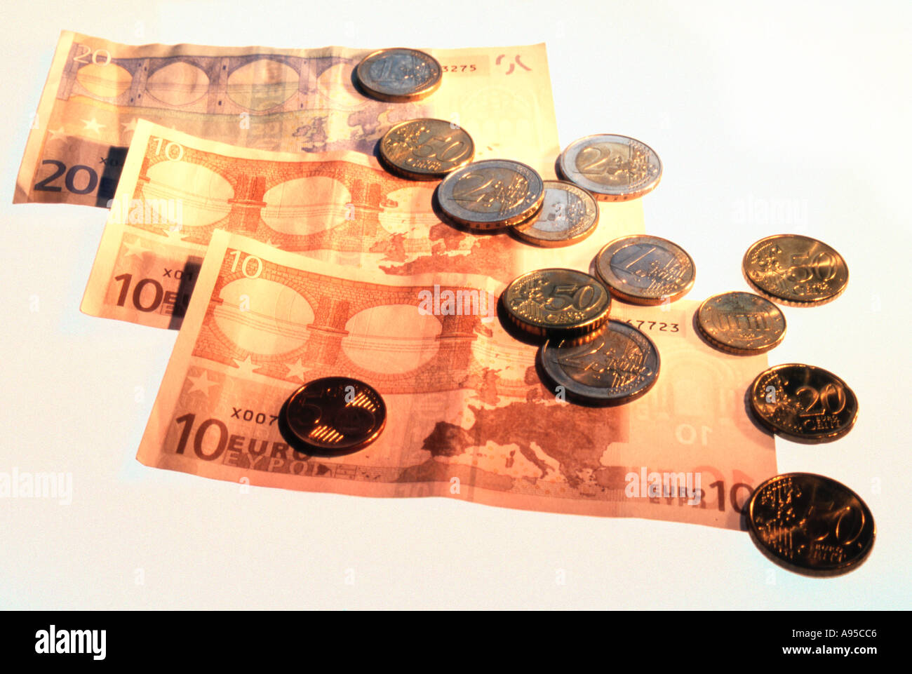 Euro notes and coins Stock Photo - Alamy