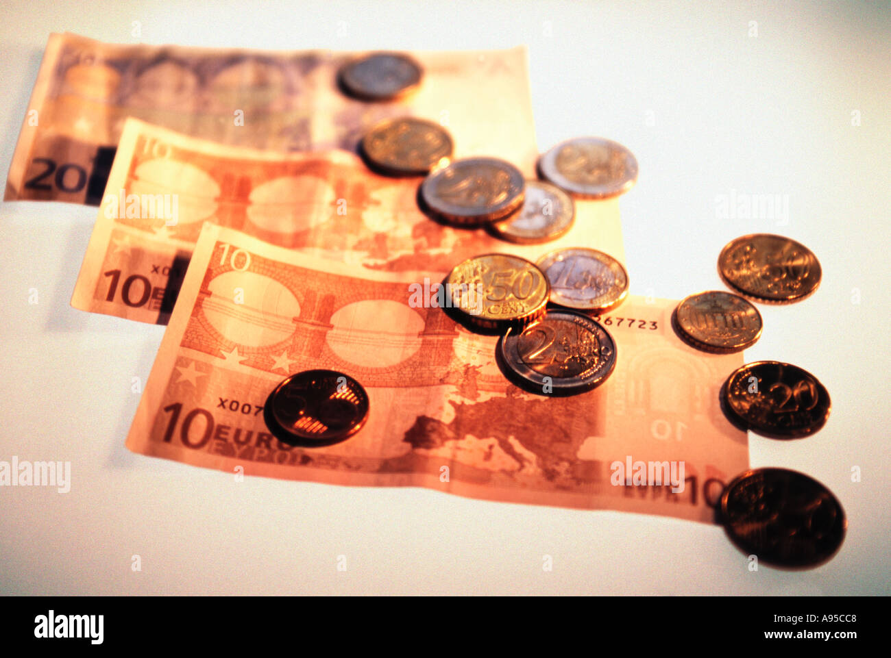 Euro notes and coins Stock Photo - Alamy