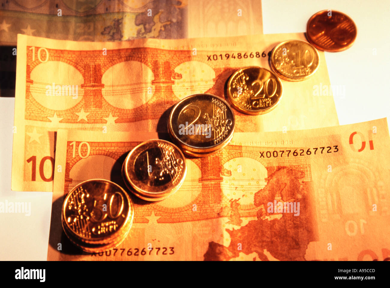 Euro notes and coins Stock Photo - Alamy