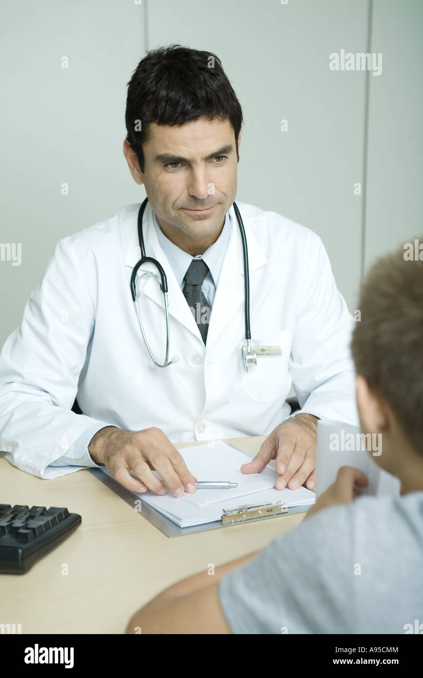 Two men sitting across the desk hi-res stock photography and images - Alamy