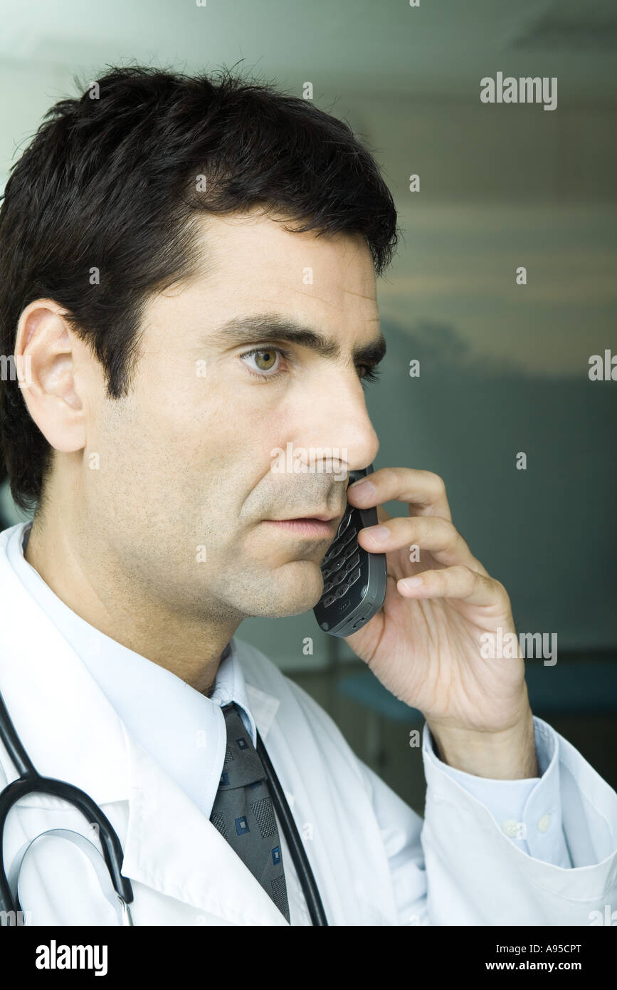 Doctor making phone call Stock Photo - Alamy