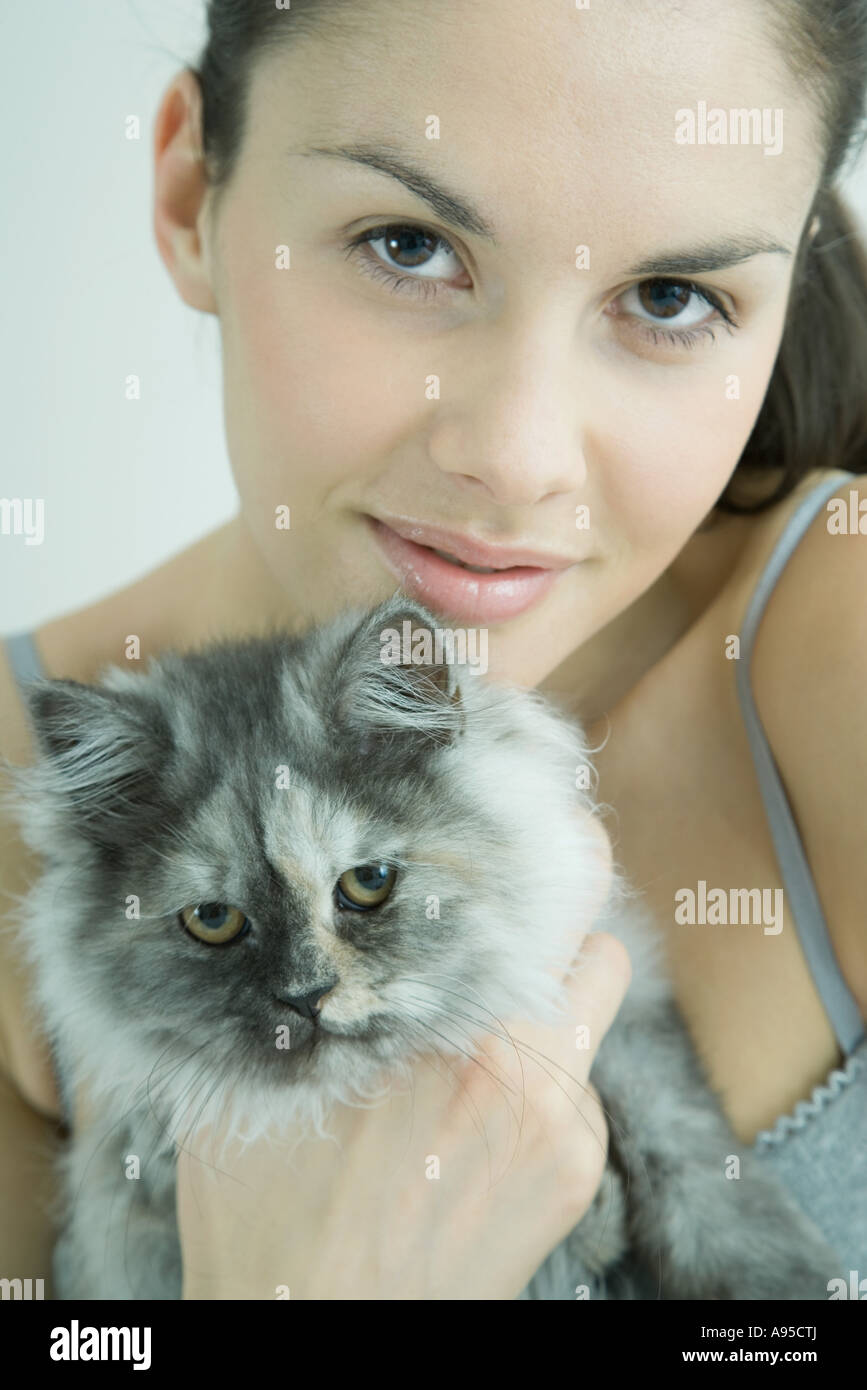 Young woman holding cat, portrait Stock Photo - Alamy